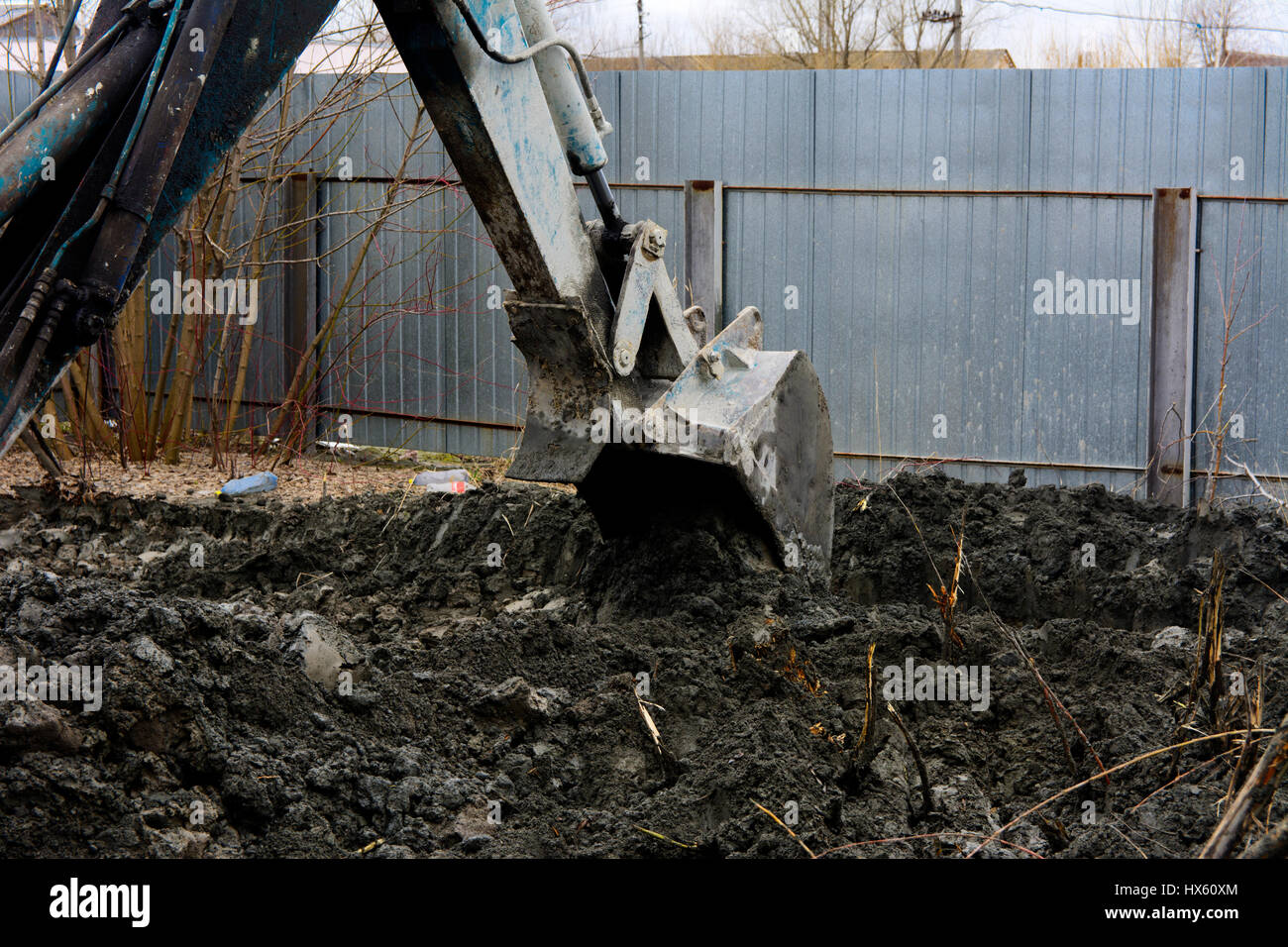 An old Soviet tractor digs and loads waste stone processing near the ...