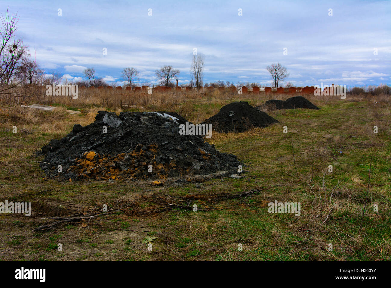 Pile of pulp in the field. Waste from the processing of granite in the ...