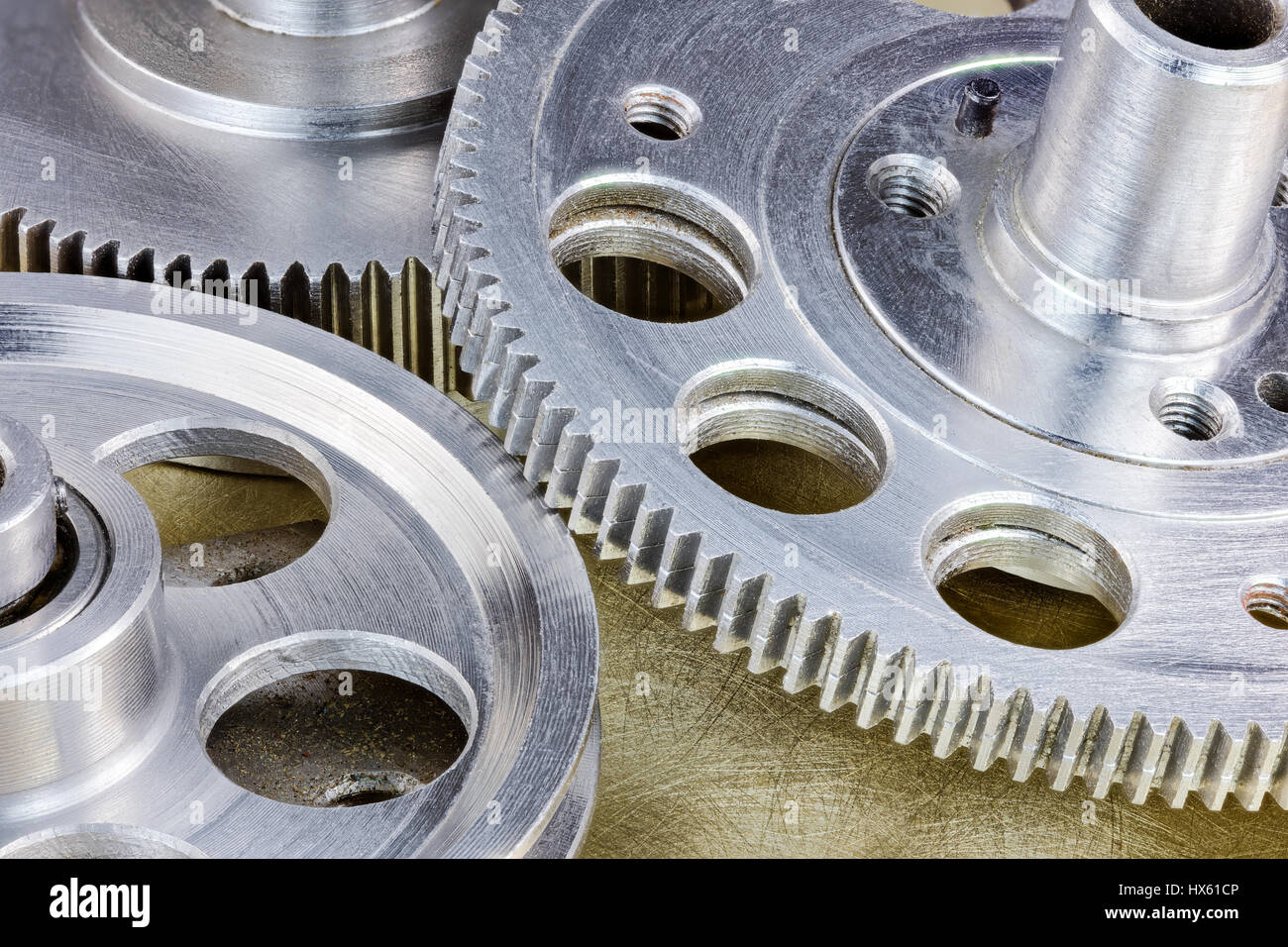 metal used gear cogwheels and pulley on industrial background closeup ...