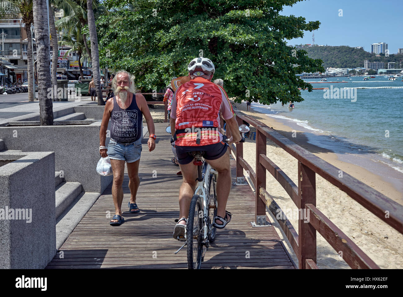 Exercise people. Cyclist riding a bicycle on the sidewalk and an ...