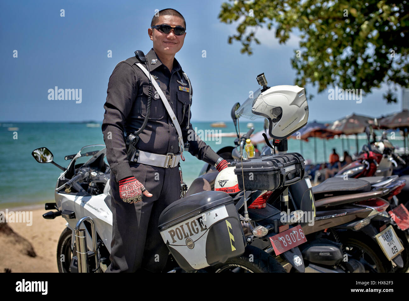 Thailand police officer. Asian policeman and motorcycle Stock Photo - Alamy