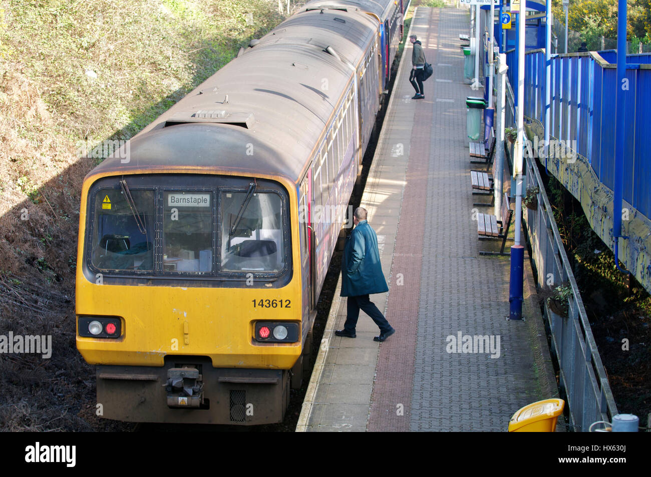GWR Railway Guard checks train before departure Stock Photo - Alamy
