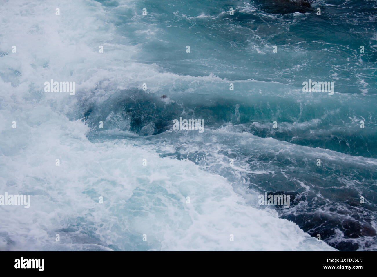 Waves Crash Against Rock Surf High Resolution Stock Photography and ...