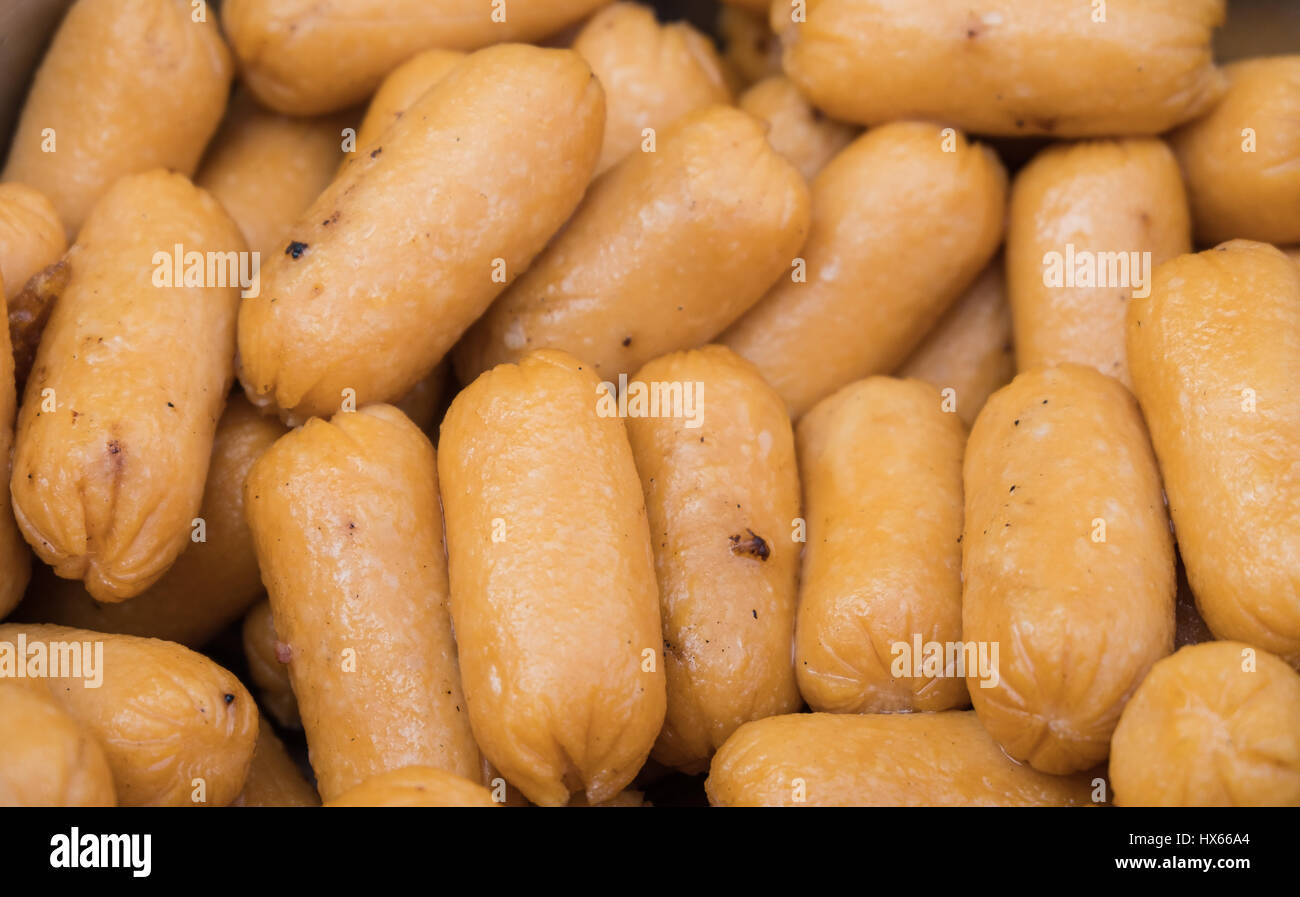Mini chicken sausage fried background Stock Photo - Alamy