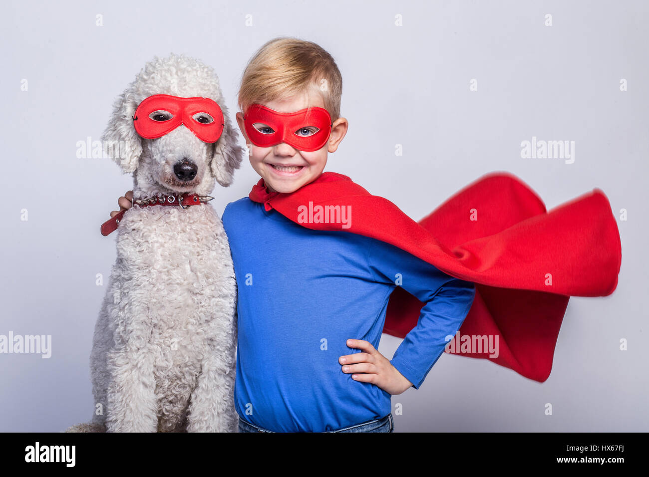 Handsome little superman with dog. Superhero. Halloween. Studio ...