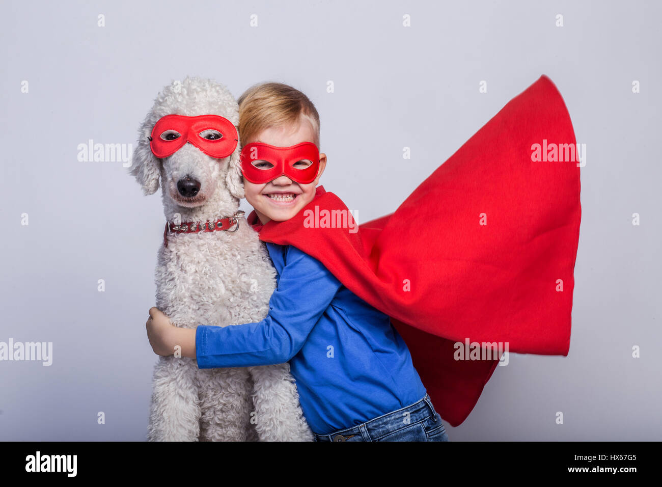 Handsome little superman with dog. Superhero. Halloween. Studio ...