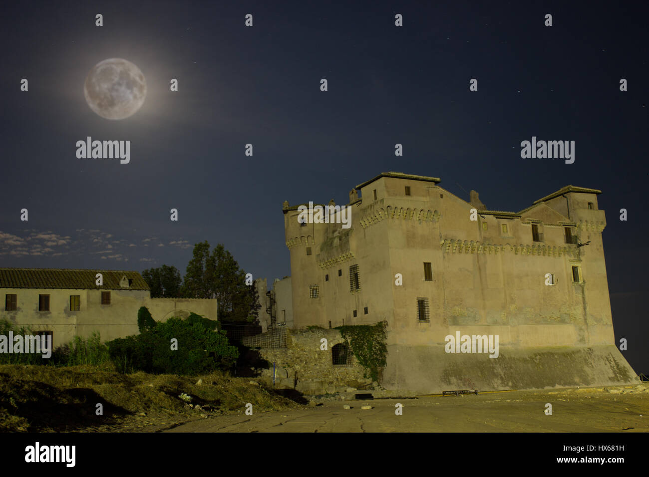 A night view of the medieval Castle of Santa Severa, a coastal town ...