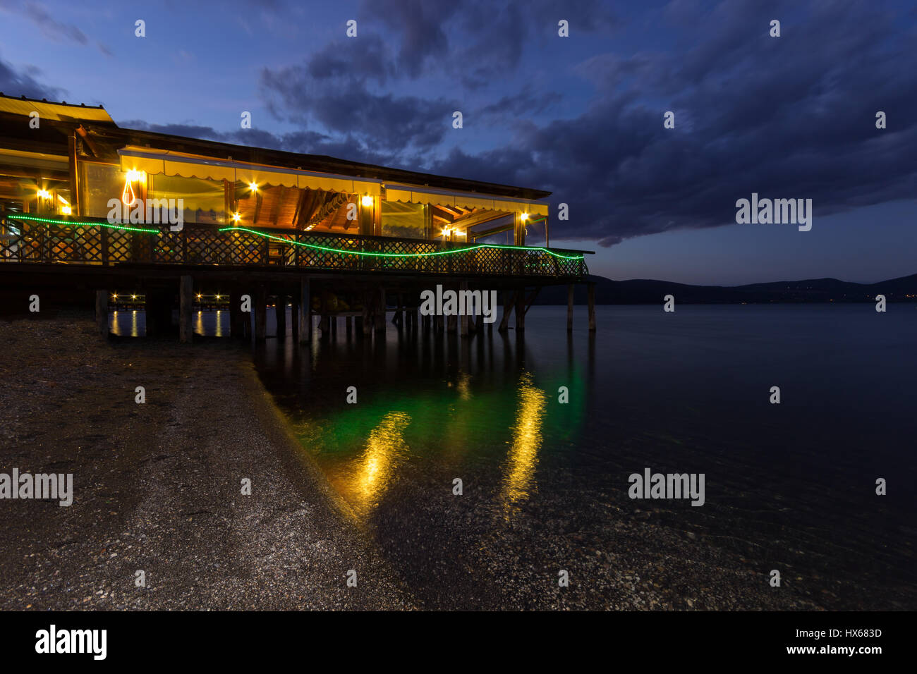 A night view of a typical italian sea restaurant Stock Photo - Alamy