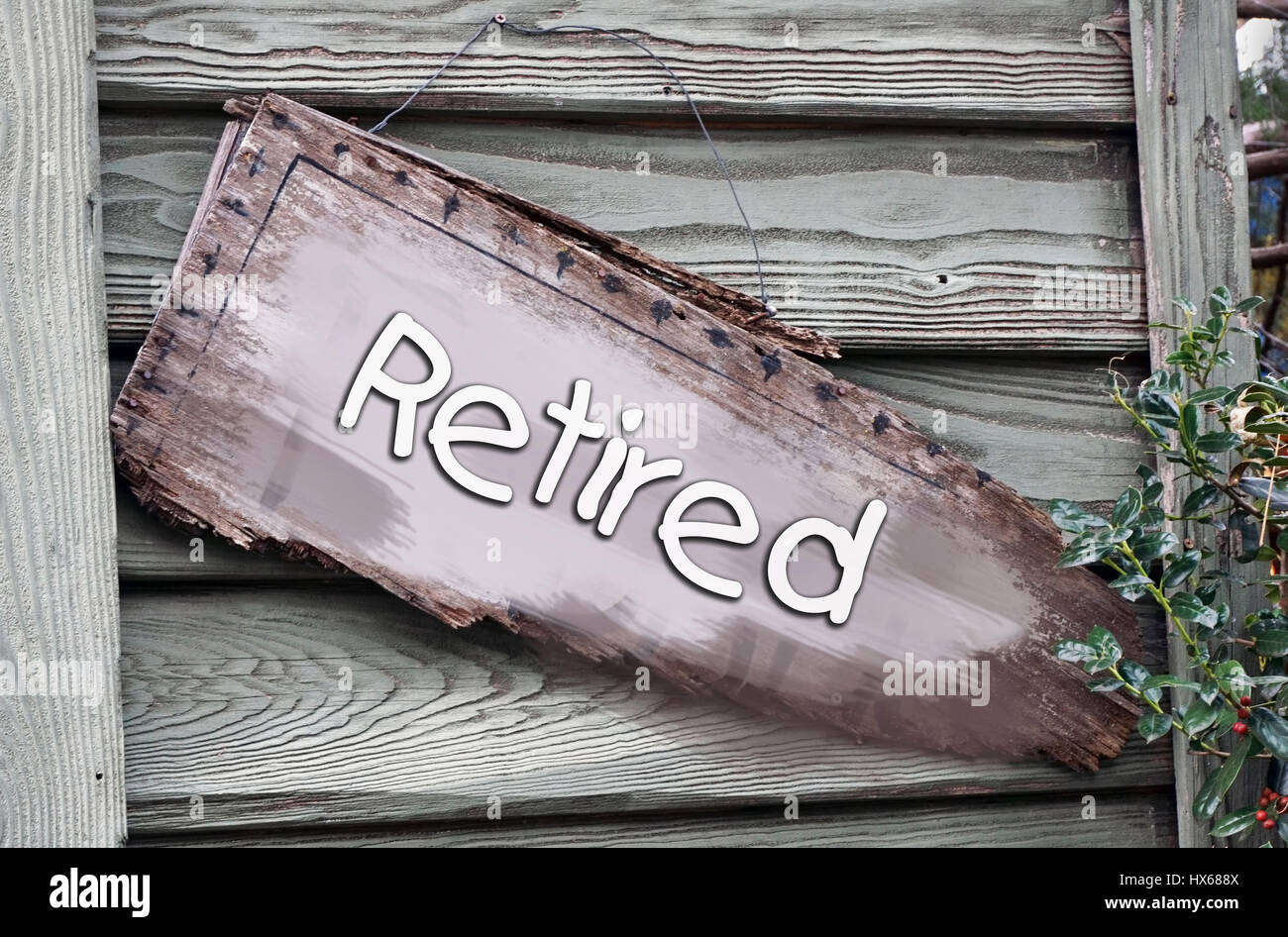 Retired hanging sign on old house Stock Photo - Alamy