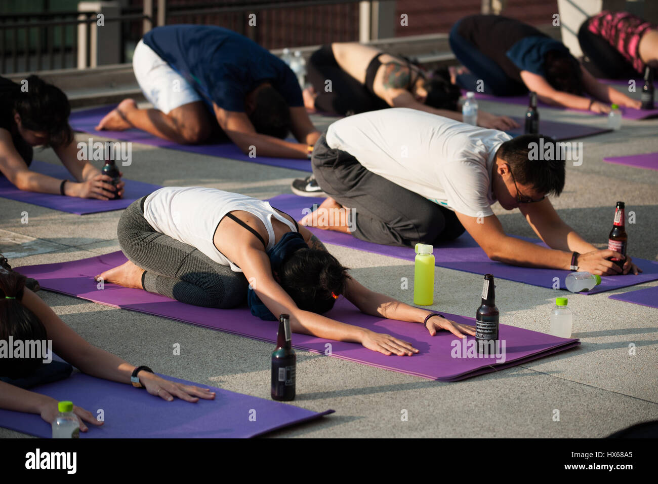 Bangkok, Thailand. 25th Mar, 2017. Participants in a beer yoga course ...