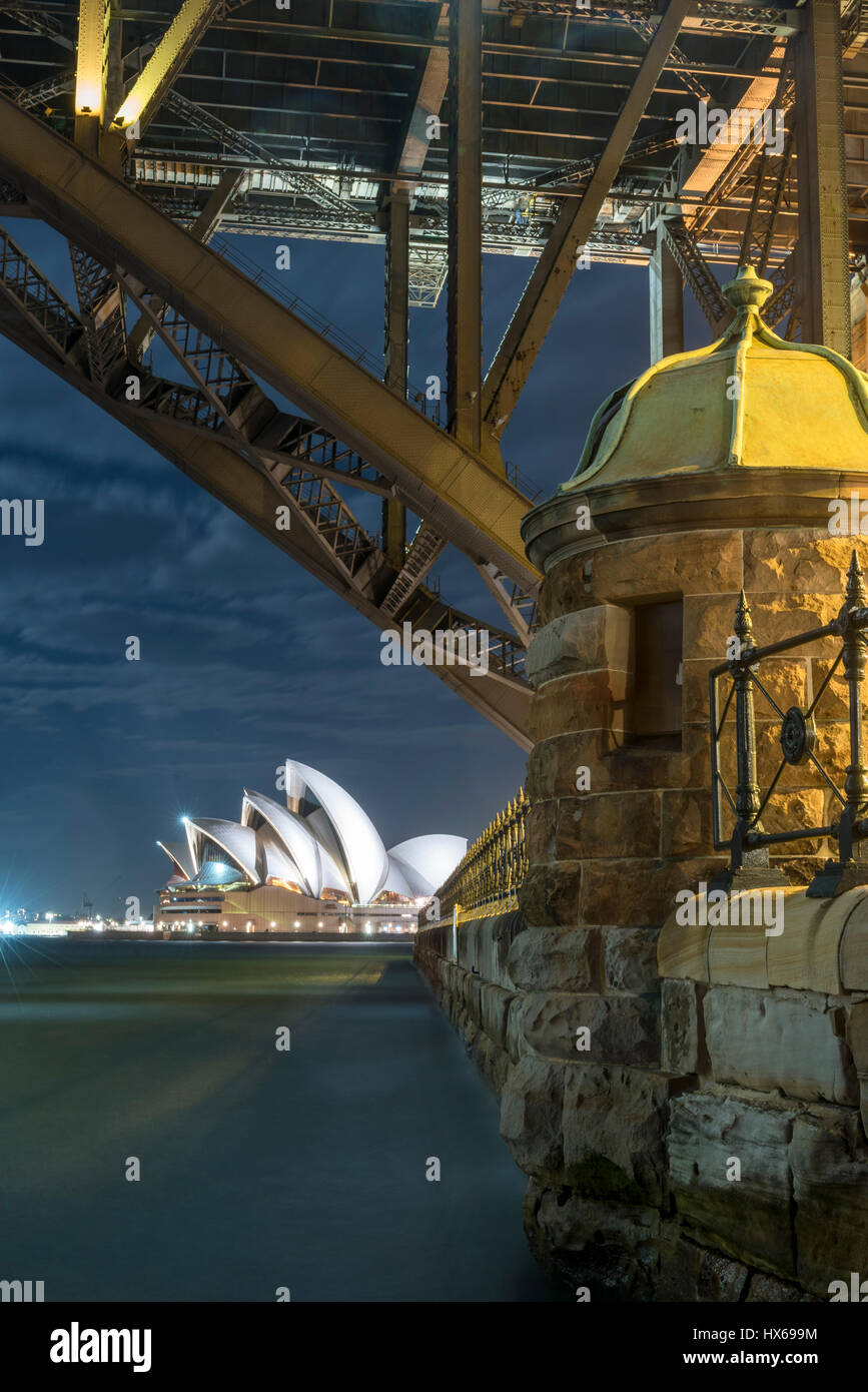 Sydney Opera House at dawn viewed from under the Sydney Harbor Bridge ...