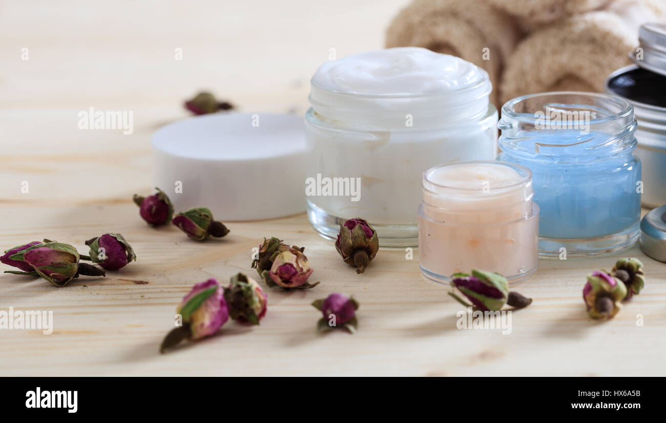 Variety of creams on wooden background - spa concept Stock Photo - Alamy