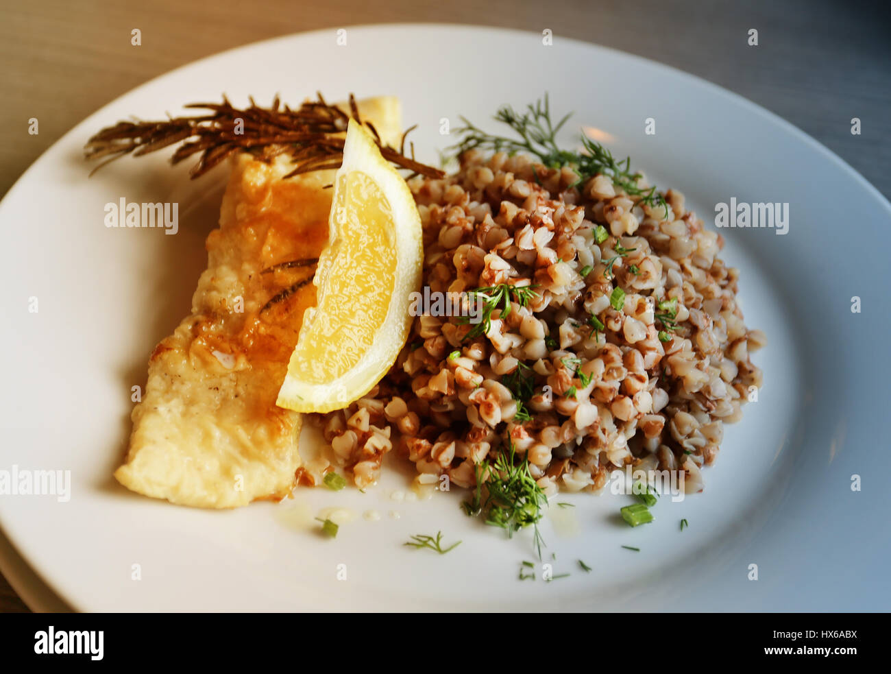 Photo dishes with buckwheat and fish in a cafe Stock Photo - Alamy