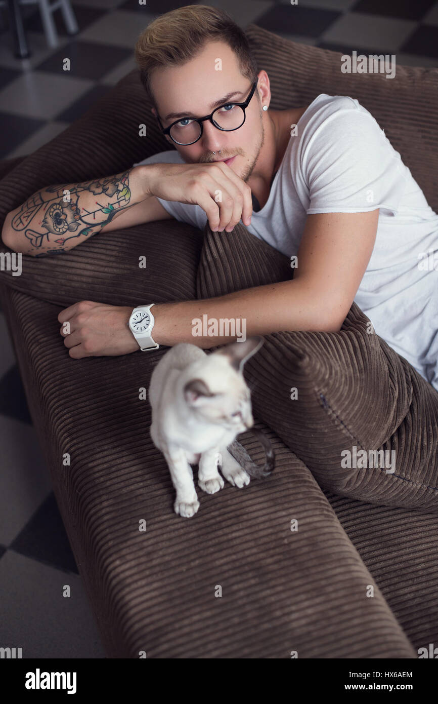 Male model holding cat High Resolution Stock Photography and Images - Alamy