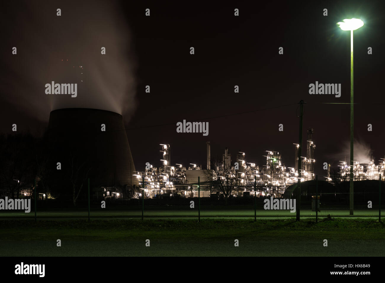 Oil refinery at night Stock Photo - Alamy