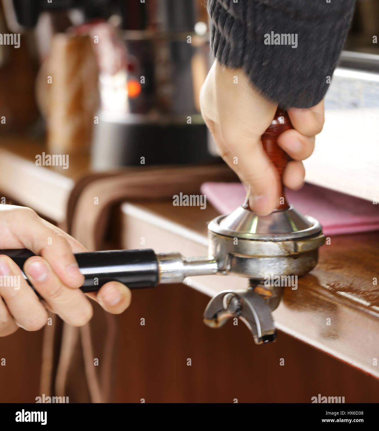 Barista makes coffee, hands in focus Stock Photo - Alamy