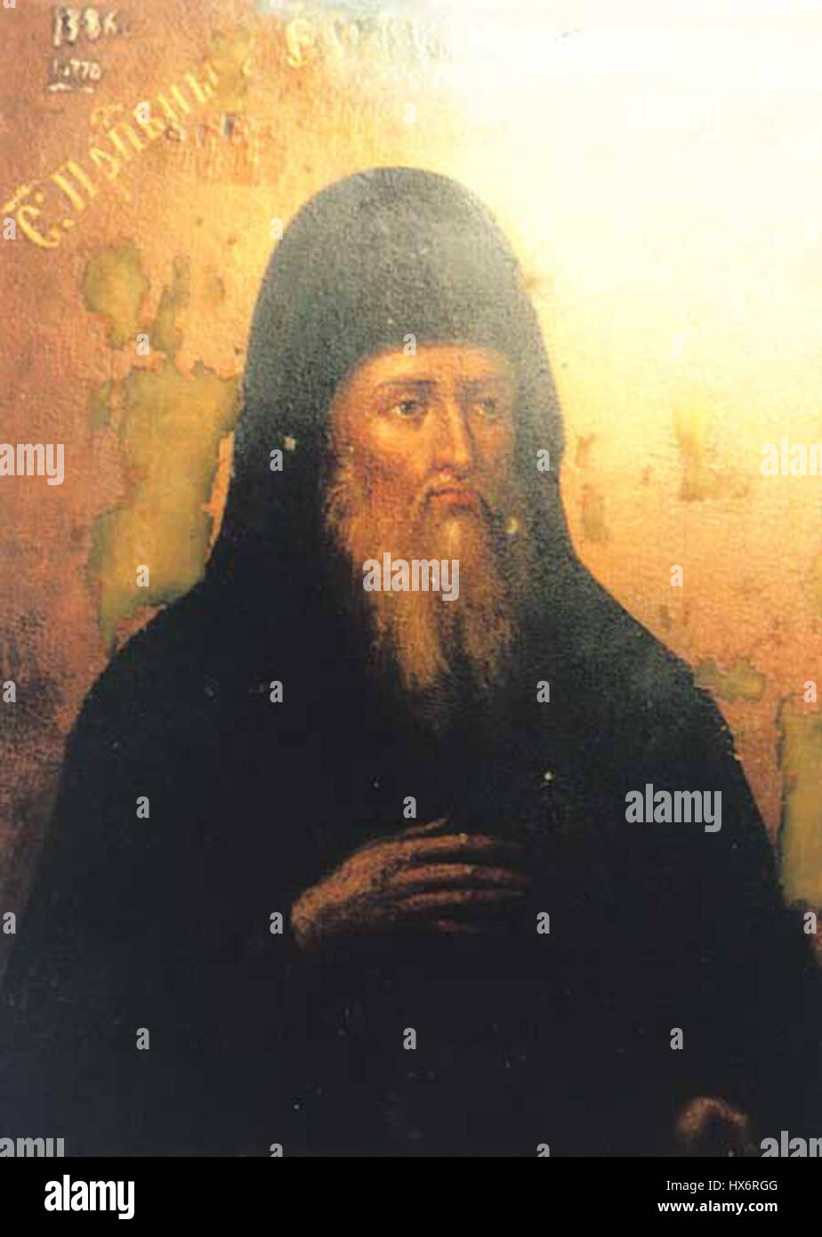 The depiction of Saint Evfimy of Kyiv Caves in this artwork highlights ...