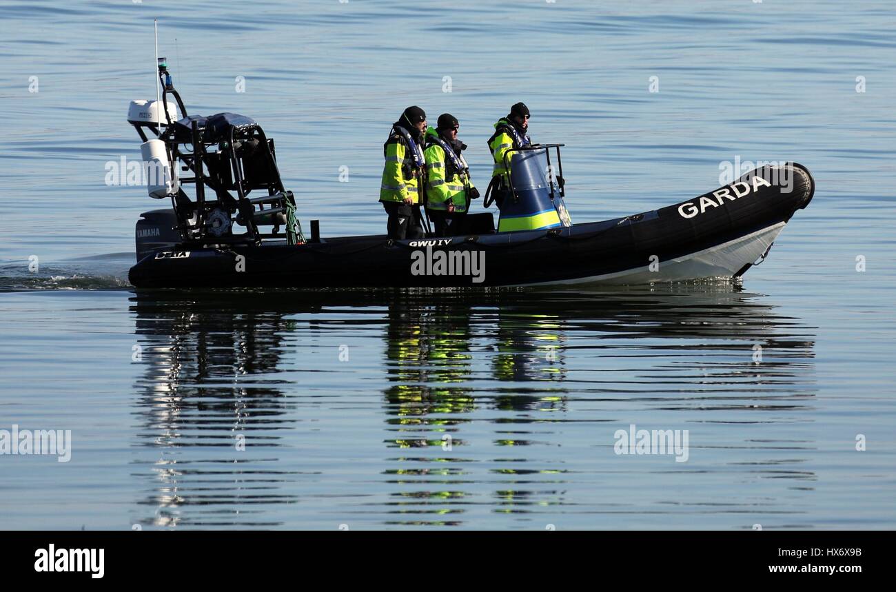 A Garda boat comes into shore at Blacksod Co. Mayo, Ireland, as the ...