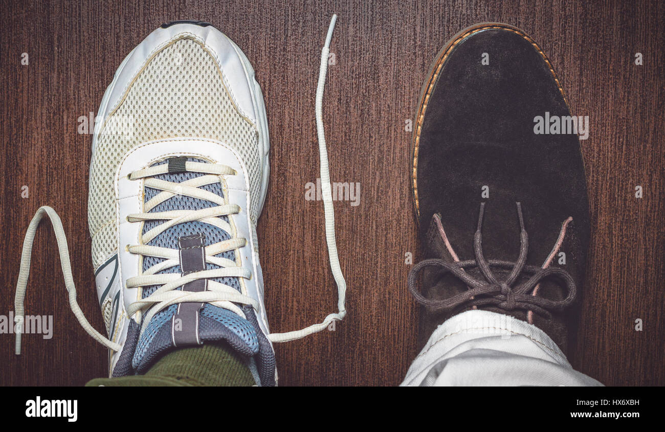 Opposing shoe styles Stock Photo - Alamy
