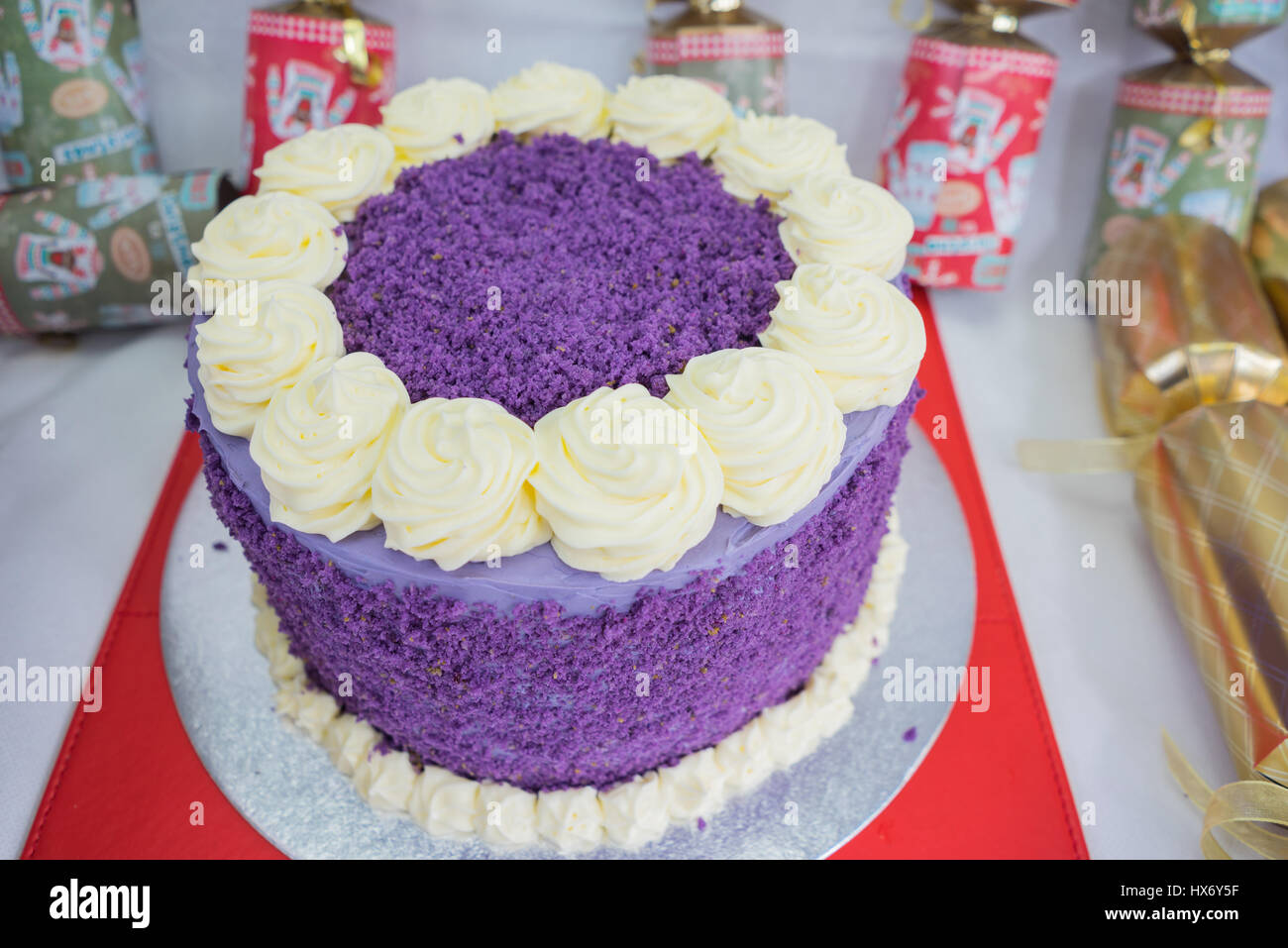 Filipino purple yam cake and sweets displayed with fruits at Christmas ...