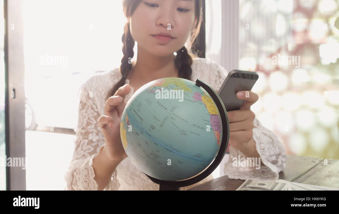 Women explore the globe to plan their travel Stock Photo - Alamy