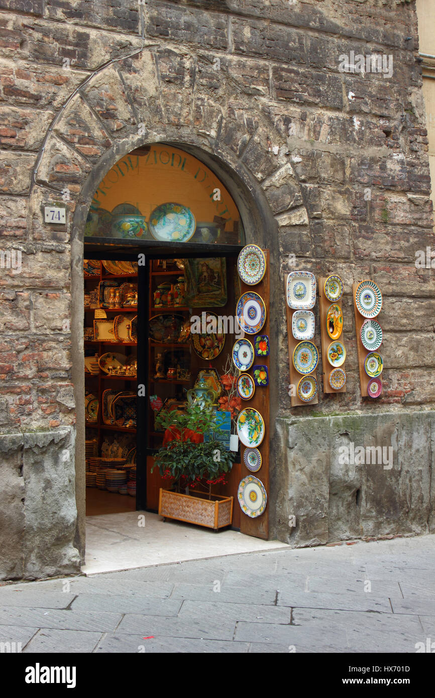 A typical traditional shop in the historic centre of Siena, Tuscany ...
