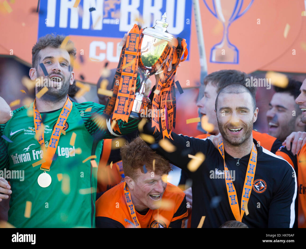 Dundee United goalkeeper Cammy Bell (left) lifts the trophy with Sean ...