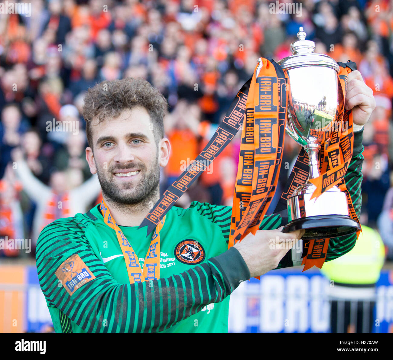 Dundee United goalkeeper Cammy Bell celebrates with the trophy after ...