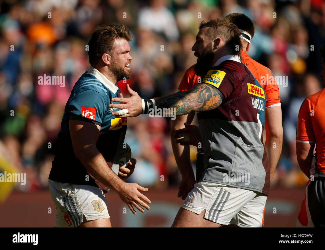 Harlequins' Rob Buchanan (left) celebrates scoring their first try ...