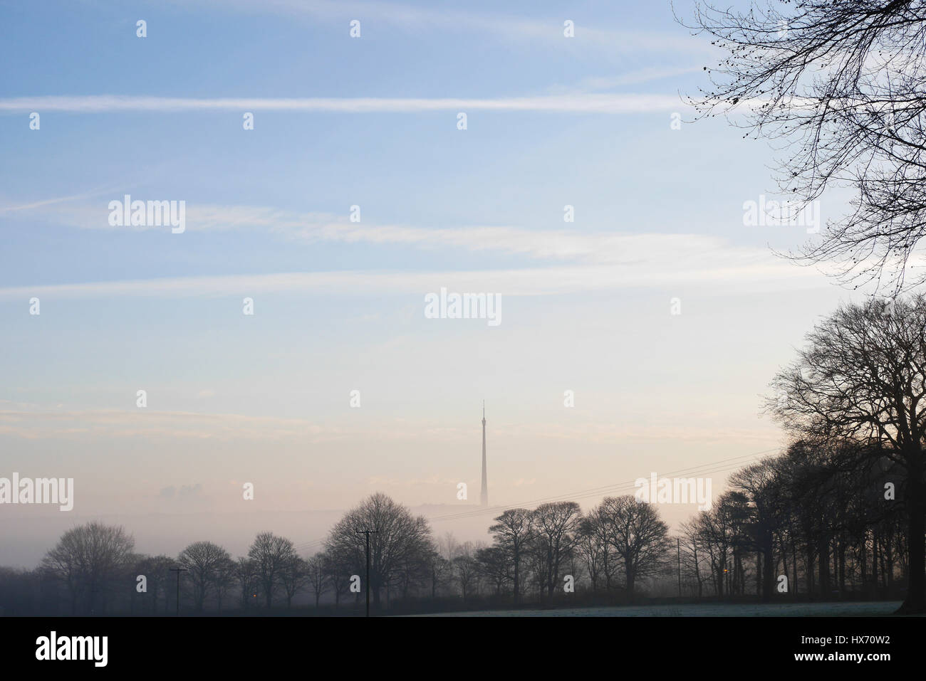 Emley Tower emerging from the morning mist in West Yorkshire Stock ...