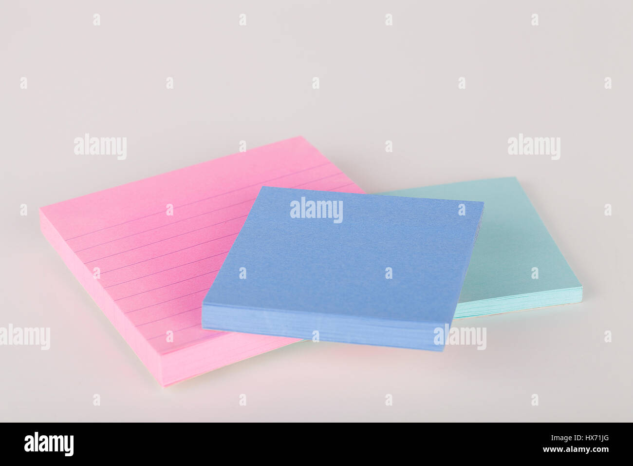 Colorful sticky notes on a white surface. Paper Post It notes isolated ...