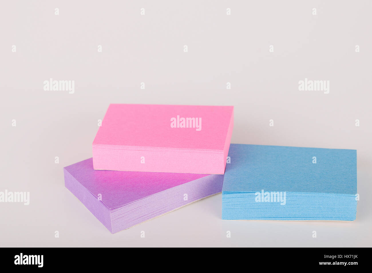 Colorful sticky notes on a white surface. Paper Post It notes isolated ...