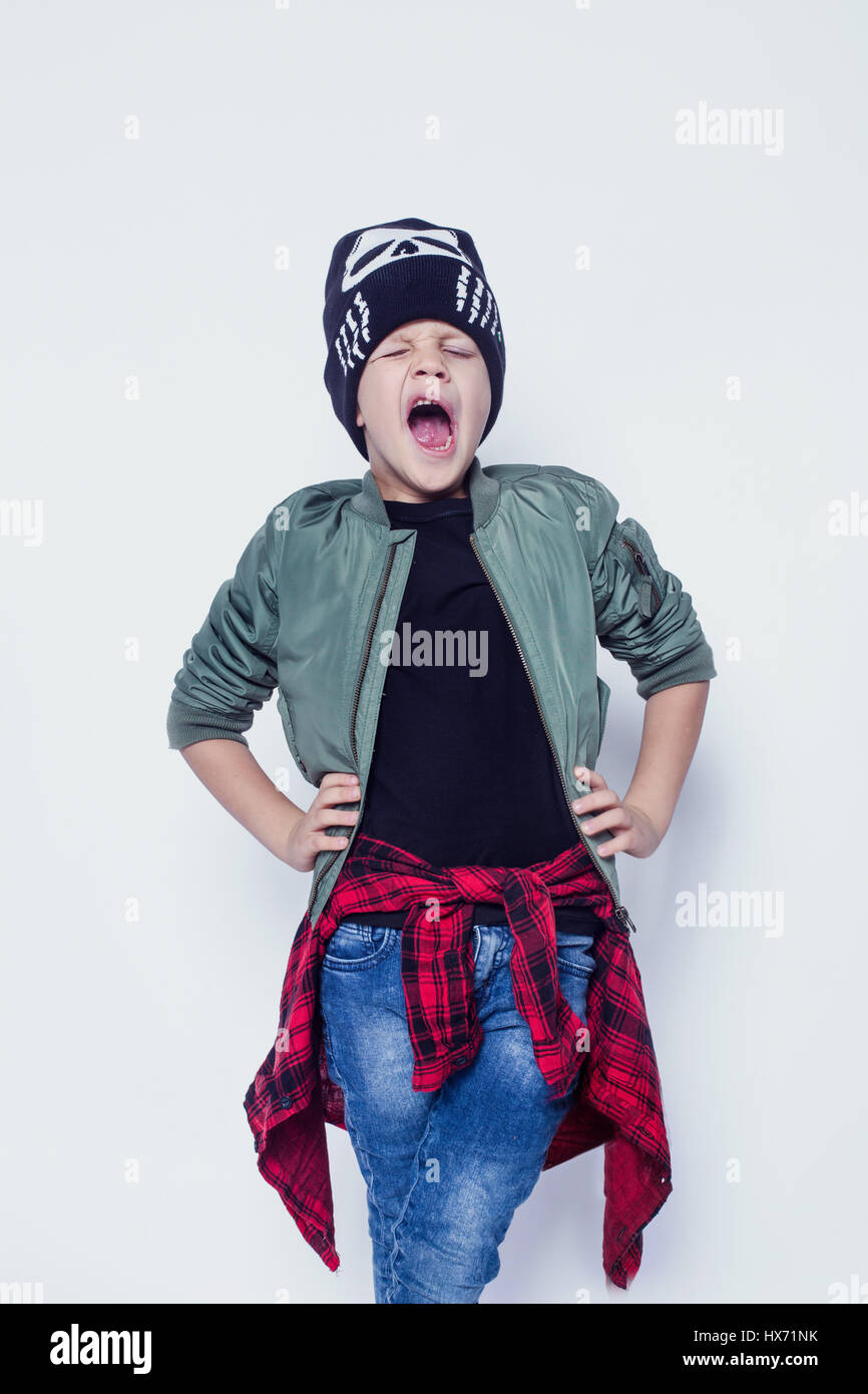 Fashionable little bad boy. Studio portrait isolated over white ...