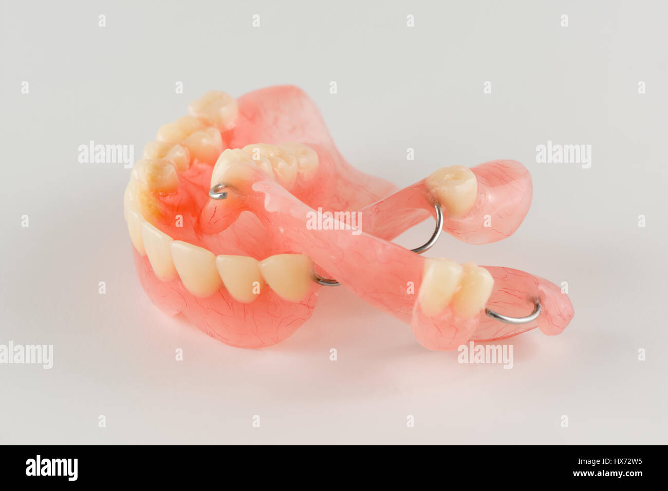 acrylic denture with metal clasps for restoring dentition Stock Photo ...