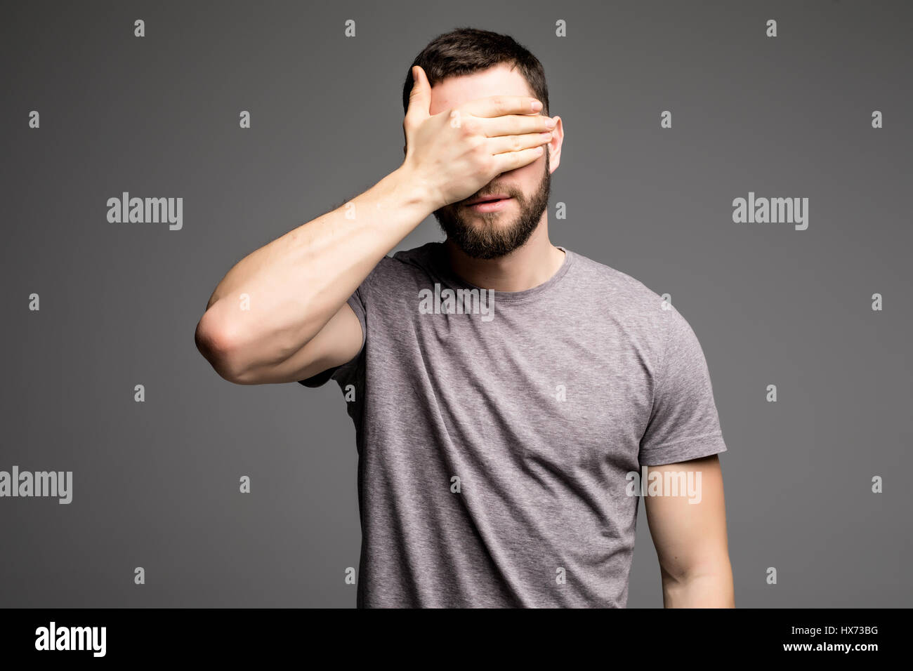 Old man covers his mouth hi-res stock photography and images - Alamy