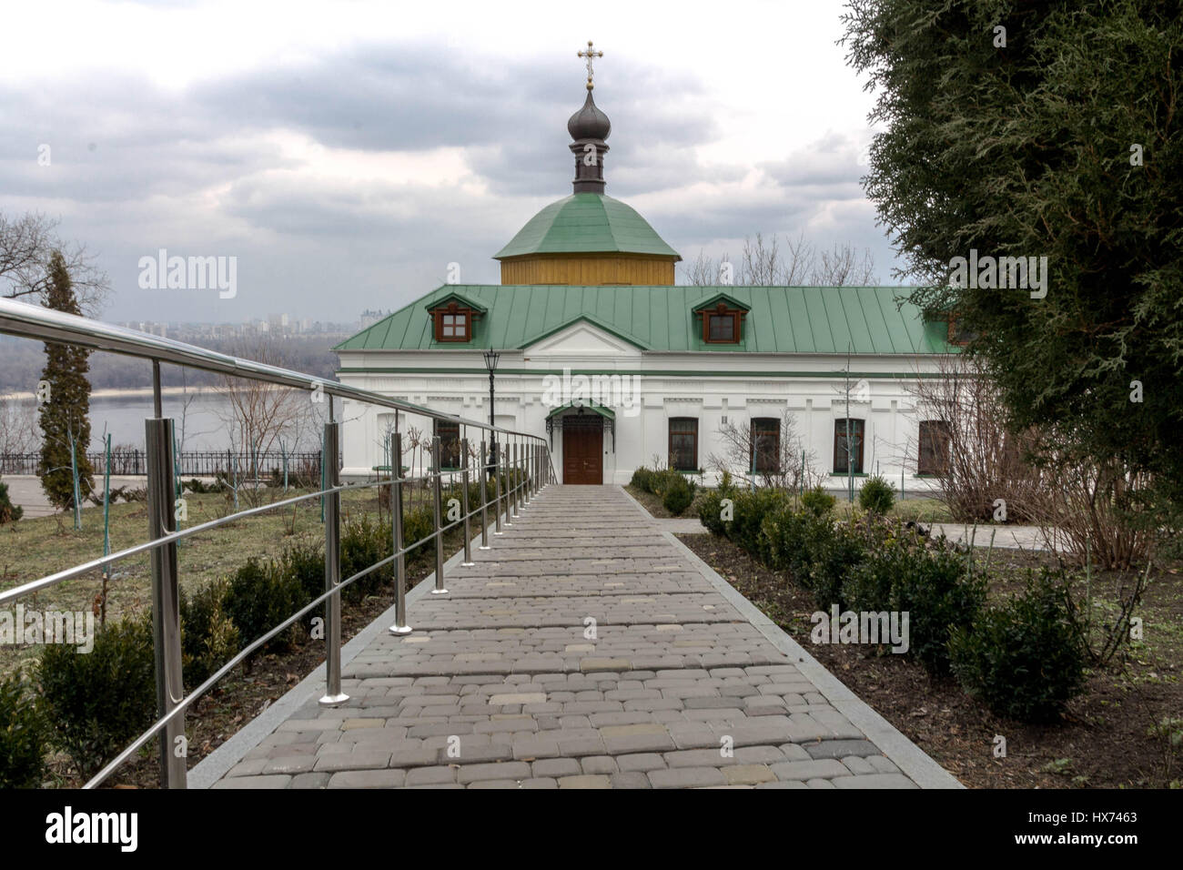The long path to the church. Gloomy skies over the church Stock Photo ...