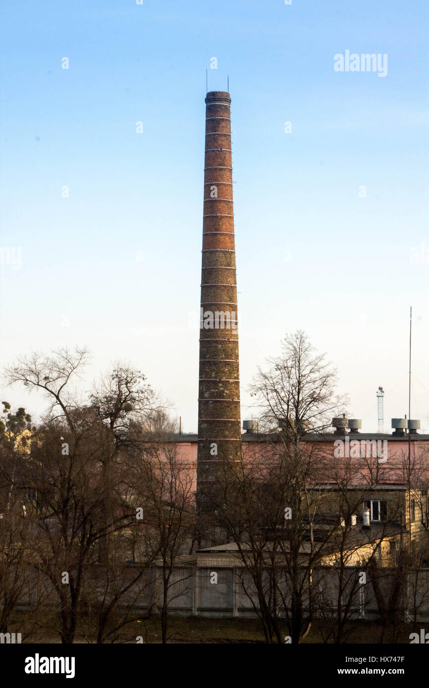 Chimney of factory. Long chimney. Tube. Production. Blue sky Stock ...