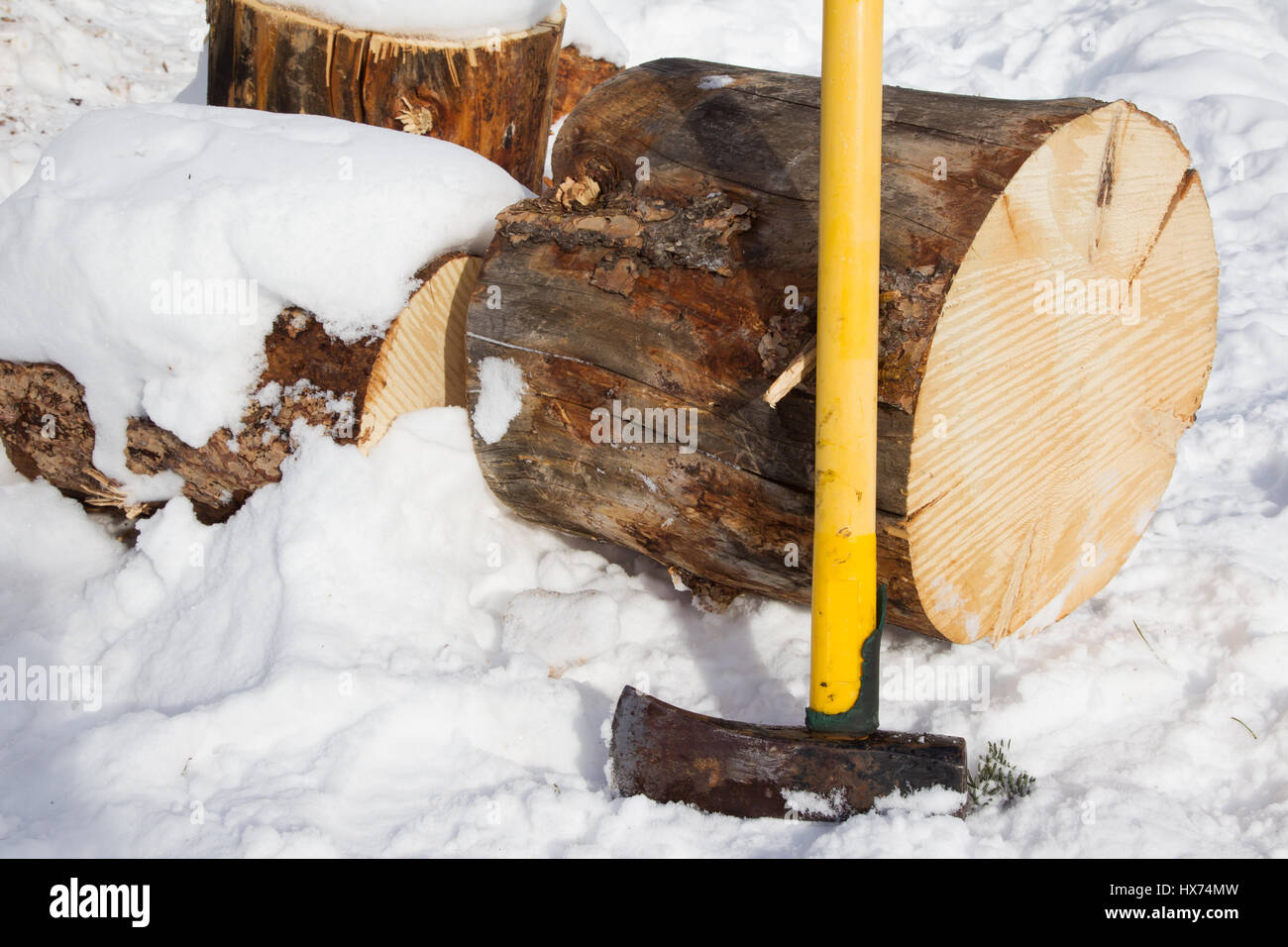 Ready for winter firewood splitting with a big hefty axe Stock Photo ...