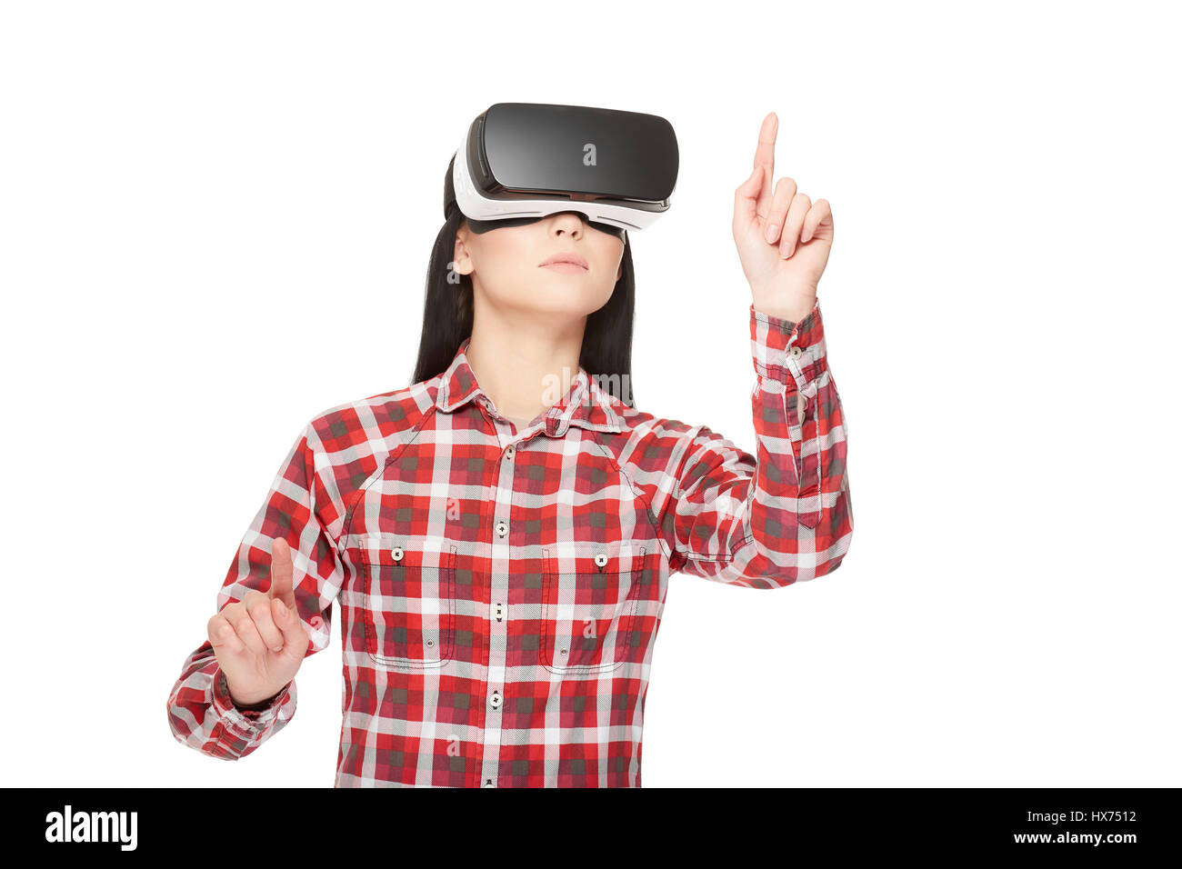 Girl in VR headset making choose and pointing by fingers Stock Photo ...