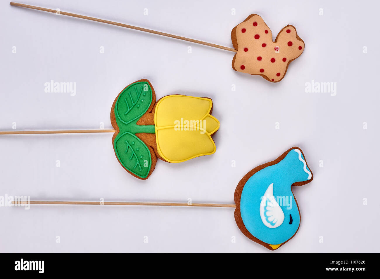 Glazed cookies on sticks isolated Stock Photo - Alamy