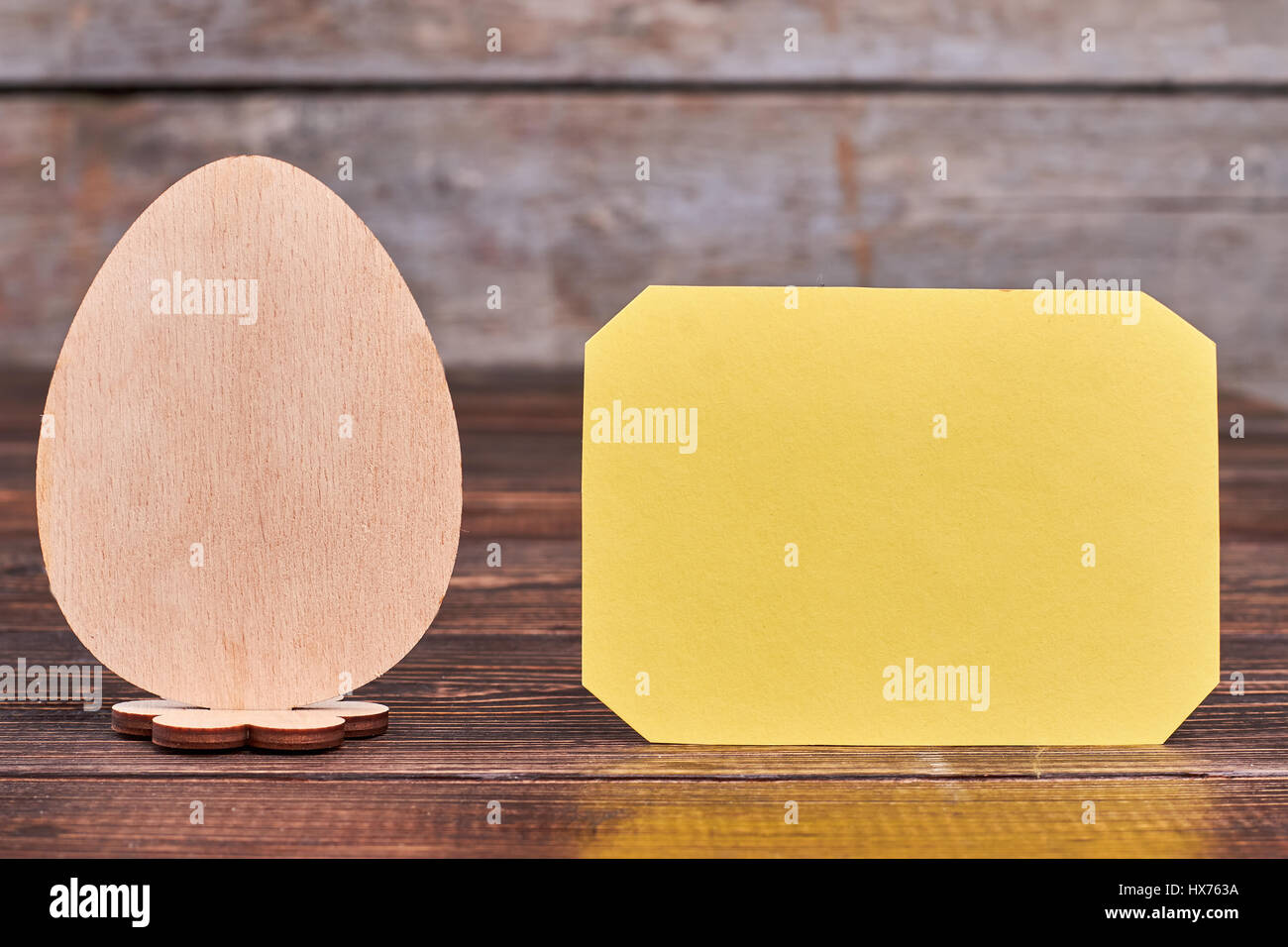 Blank card and plywood egg Stock Photo - Alamy
