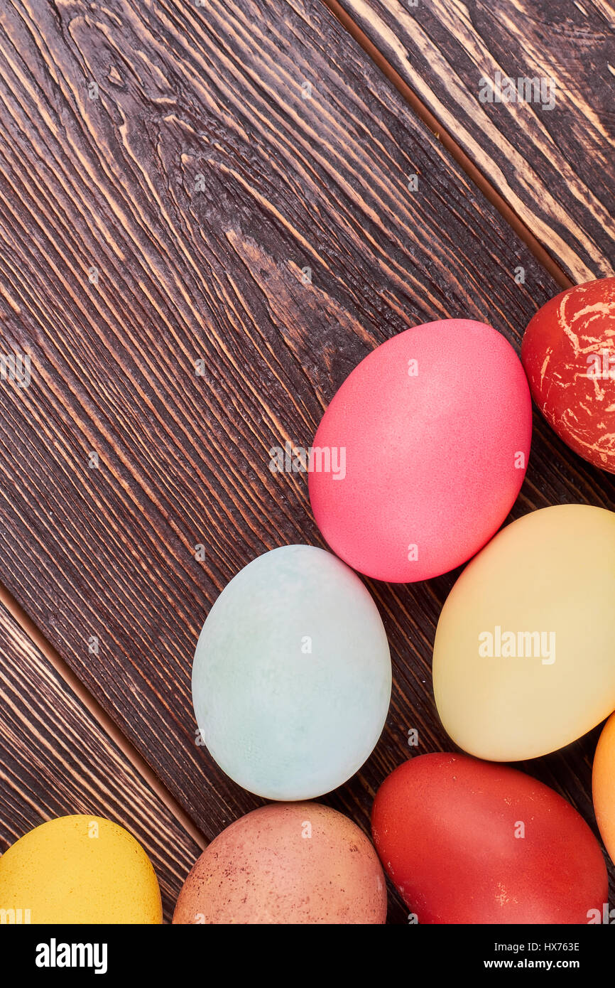 Bright Easter eggs, brown wood Stock Photo - Alamy