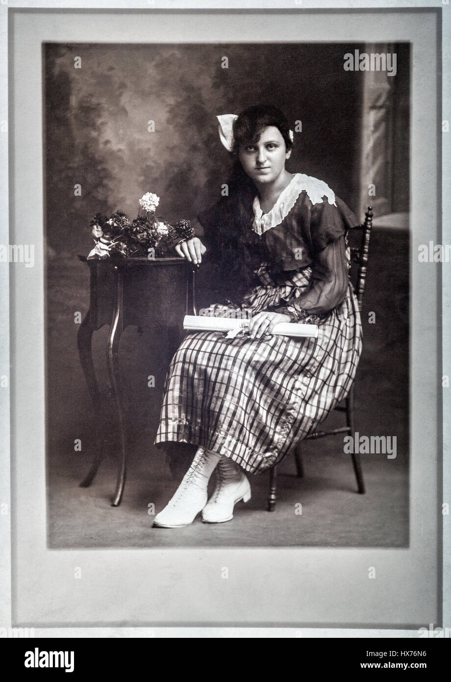 A vintage photo postcard of a high school girl holding her diploma ...