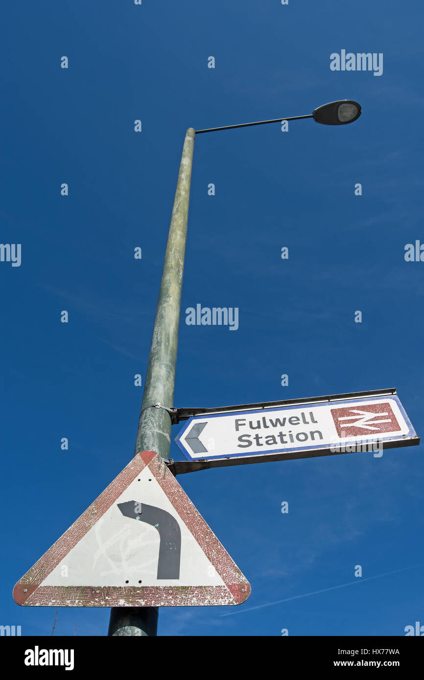 sign for fulwell station, southwest london, with road sign indicating a ...