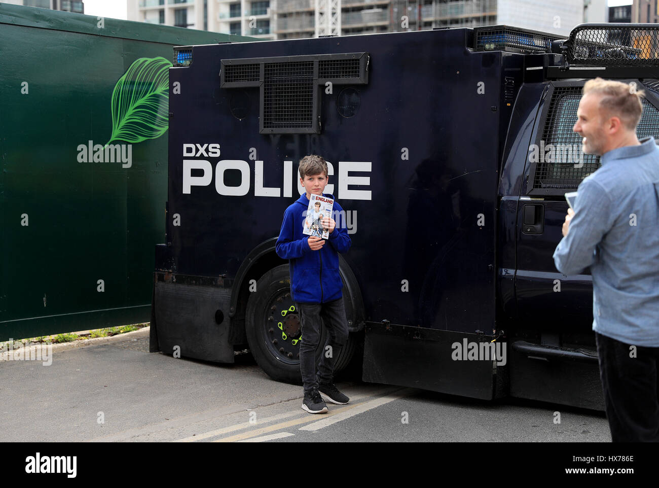 An England fan next to an armoured police vehicle before the World Cup ...