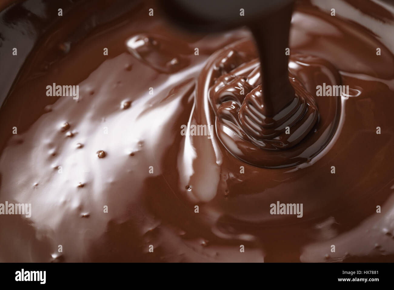 macro photo of premium dark chocolate pour in bowl, shallow focus Stock ...