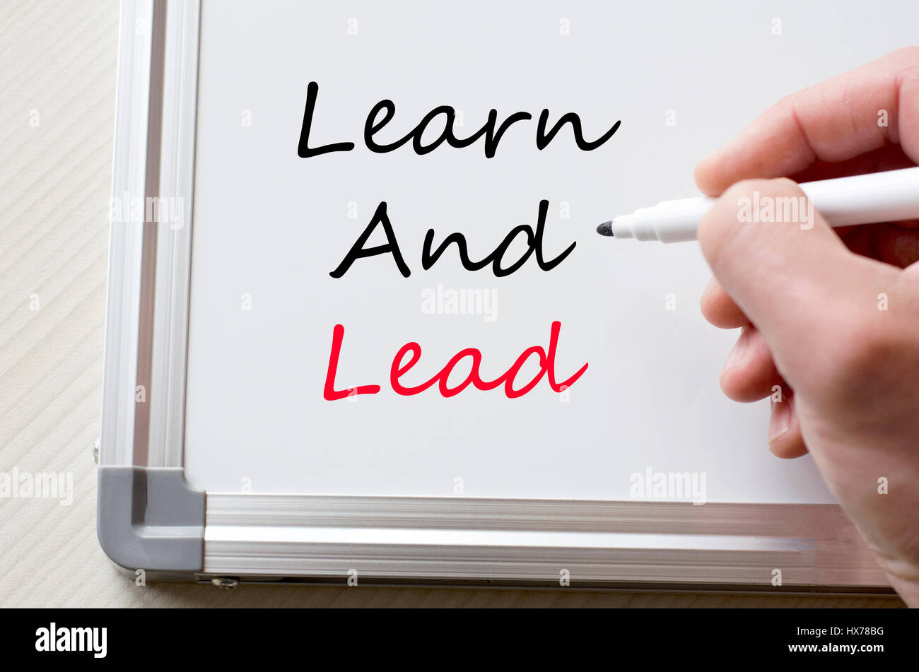 Human hand writing learn and lead on whiteboard Stock Photo - Alamy