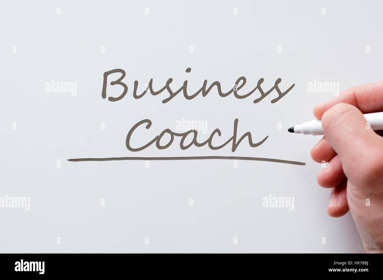 Human hand writing business coach on whiteboard Stock Photo - Alamy
