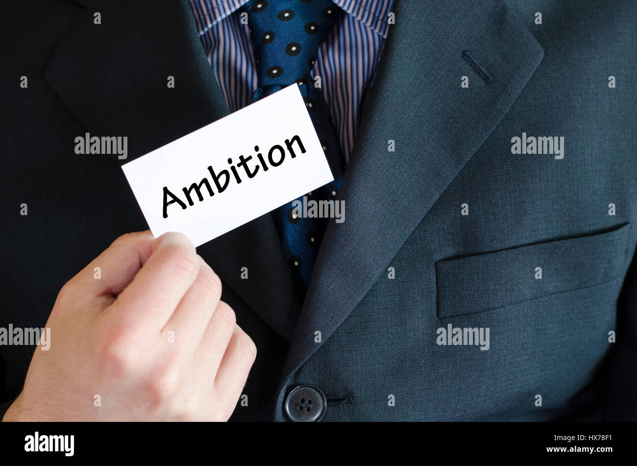 Ambition text note concept over business man background Stock Photo - Alamy