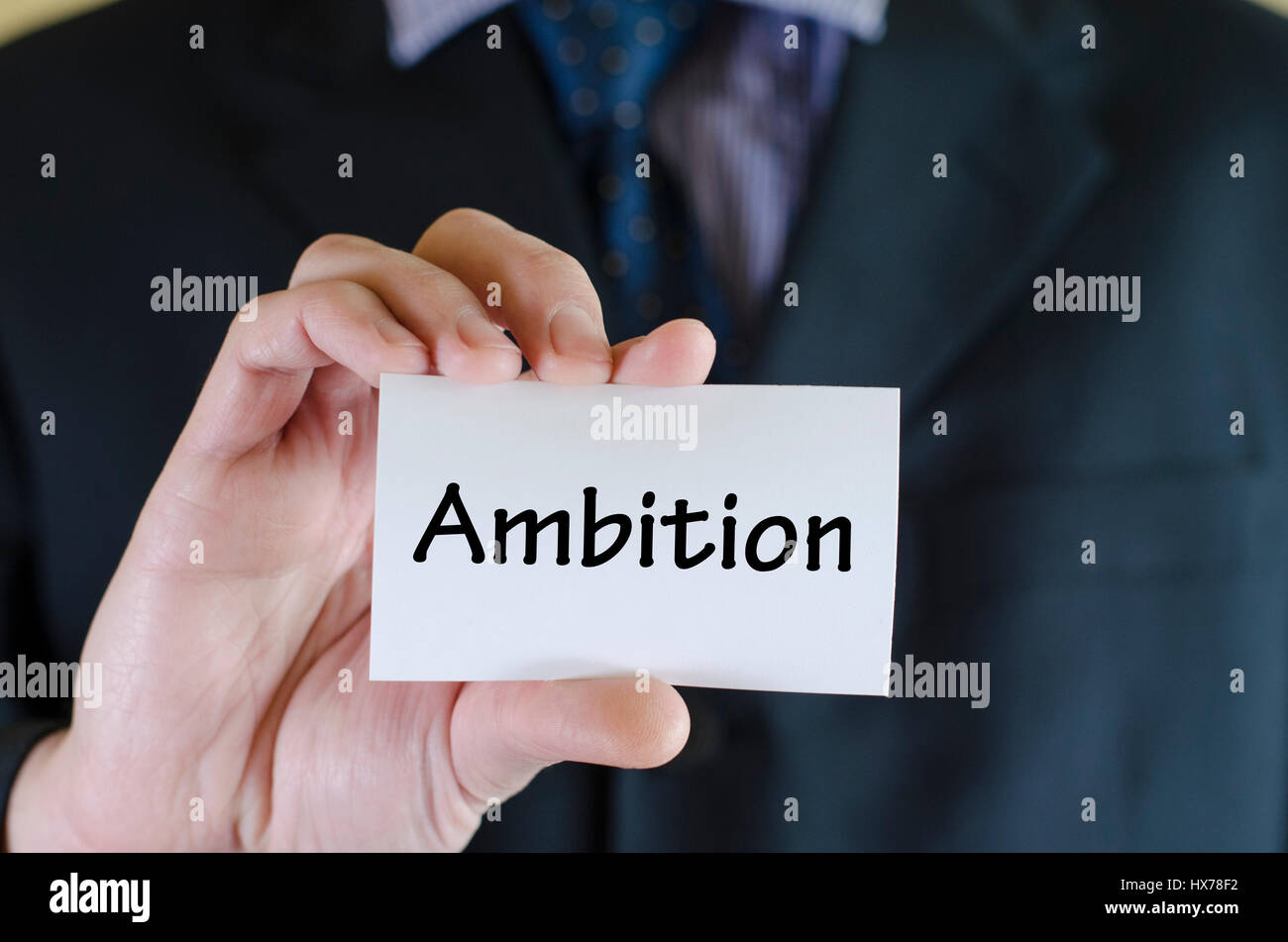 Ambition text note concept over business man background Stock Photo - Alamy